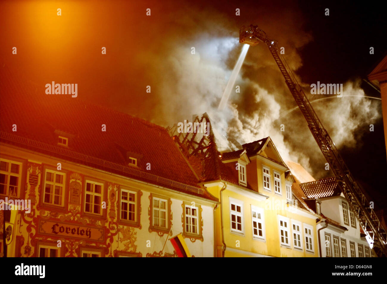 Firemen work during a huge fire in the historical city center of Coburg ...