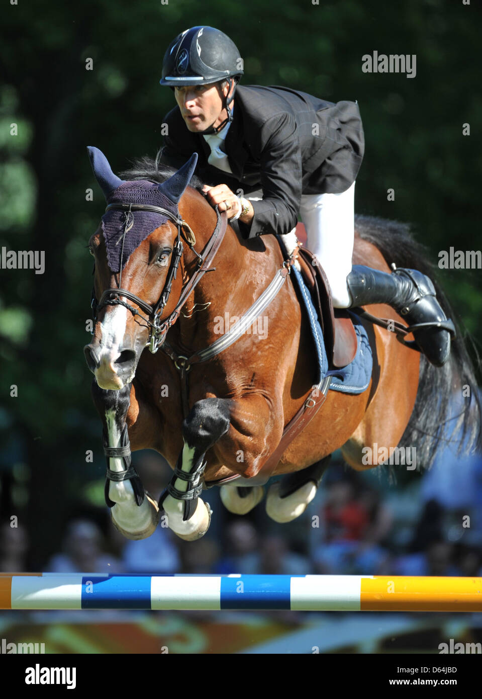 Richard Spooner, USA, jumps with his horse cristallo during the Global ...