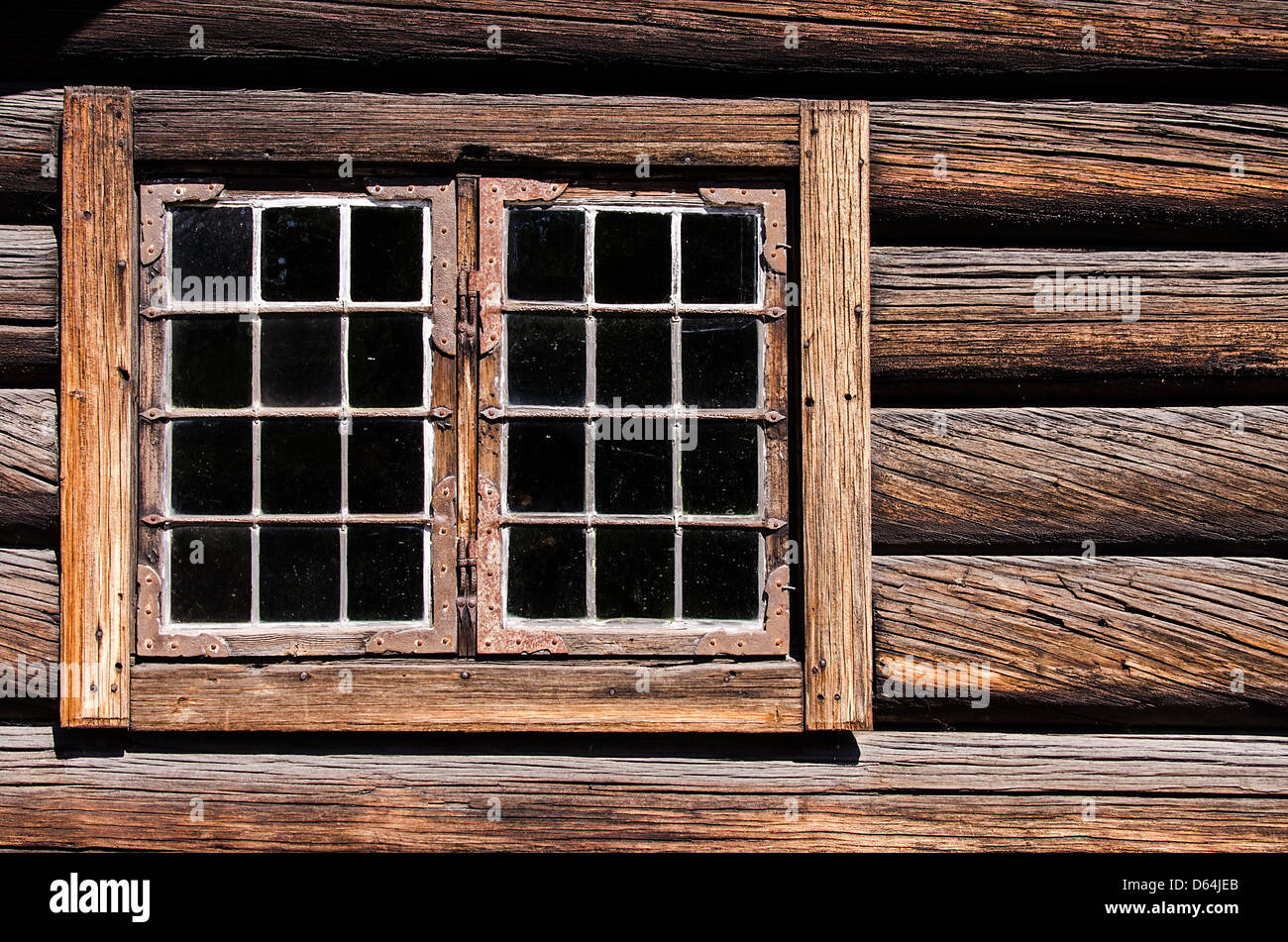 Weathered log house wall window Stock Photo - Alamy