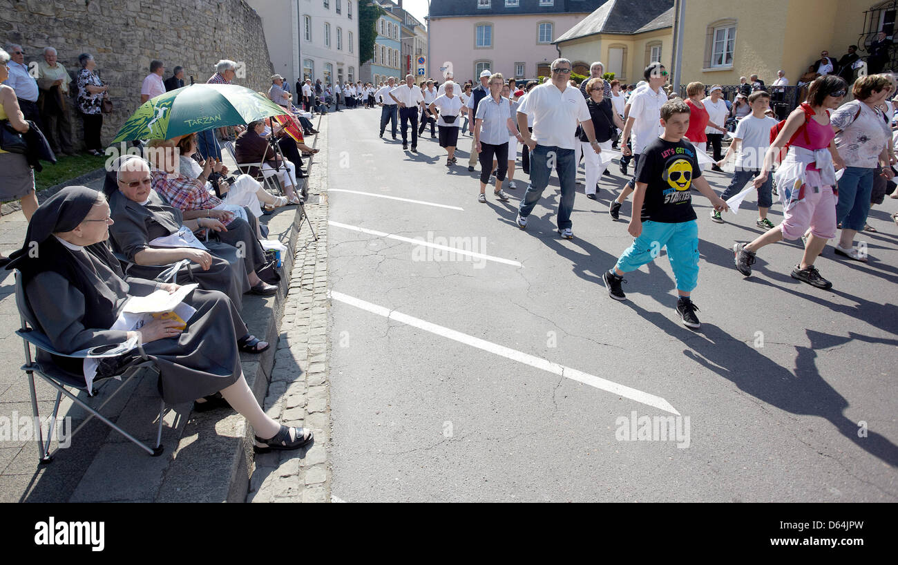 People follow the traditional Echternach procession in Echternach ...