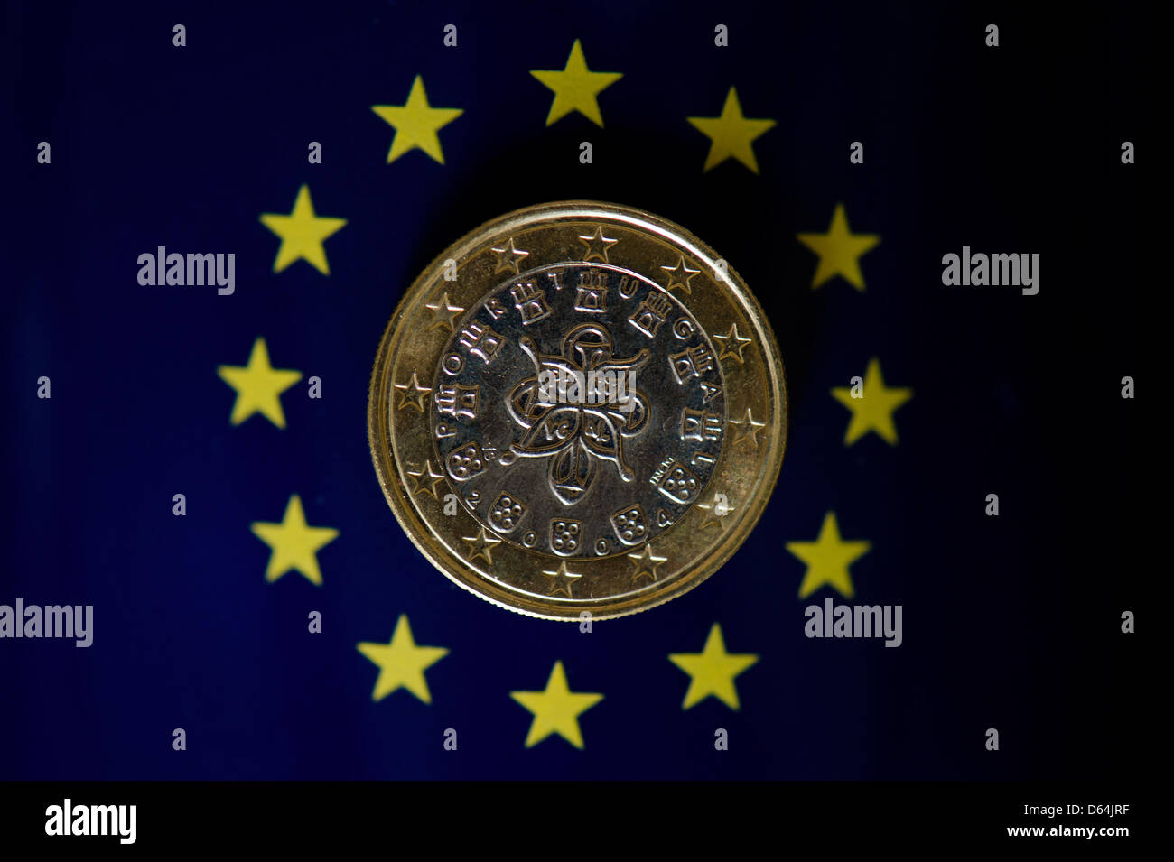 The illustration shows the Portuguese edition of a Euro coin on display on an emblem featuring ...