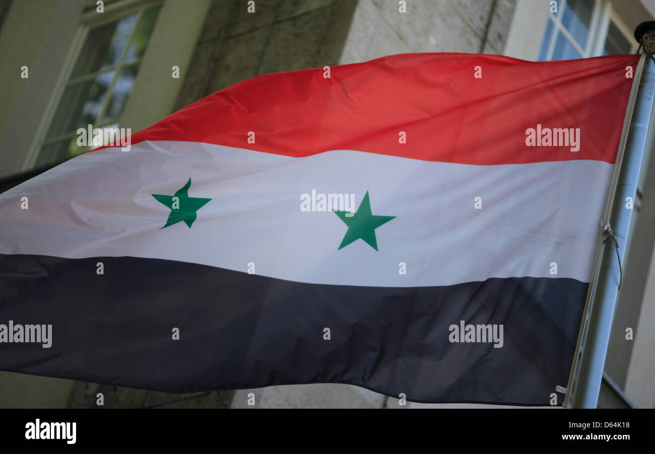 A Syrian flag waves at the Syrian Embassy in Berlin, Germany, 29 May ...