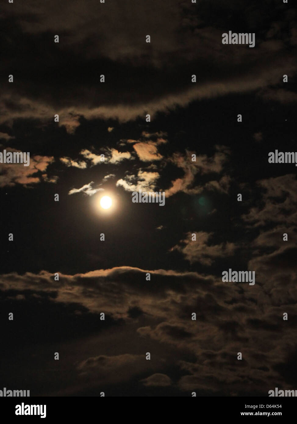 The photo captures the serene night sky illuminated by moonlight, with ...