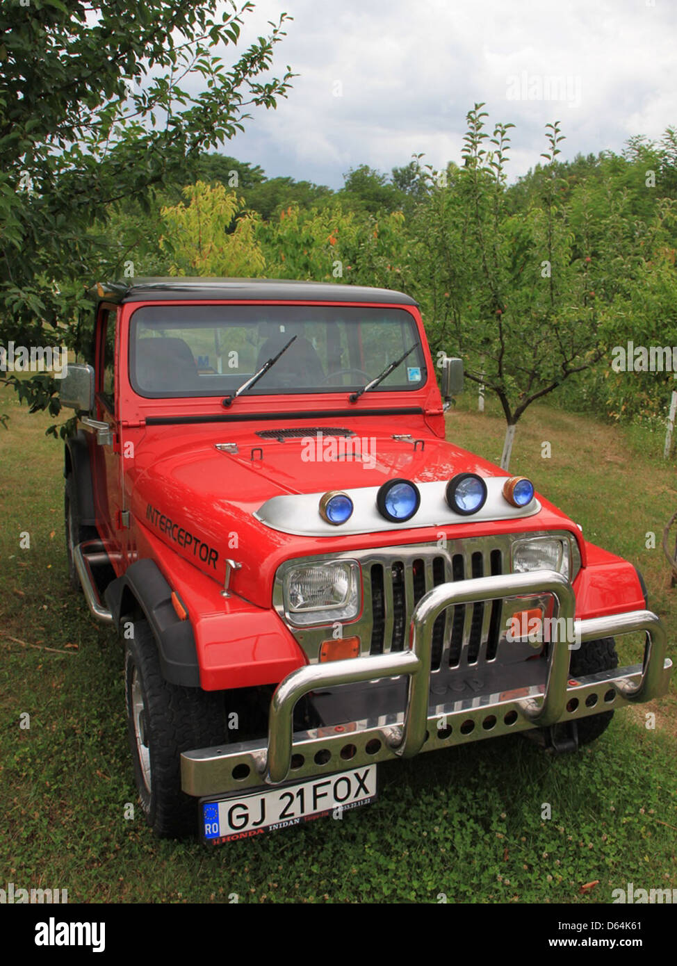 This image showcases a red Jeep Wrangler 4x4, a popular off-road ...