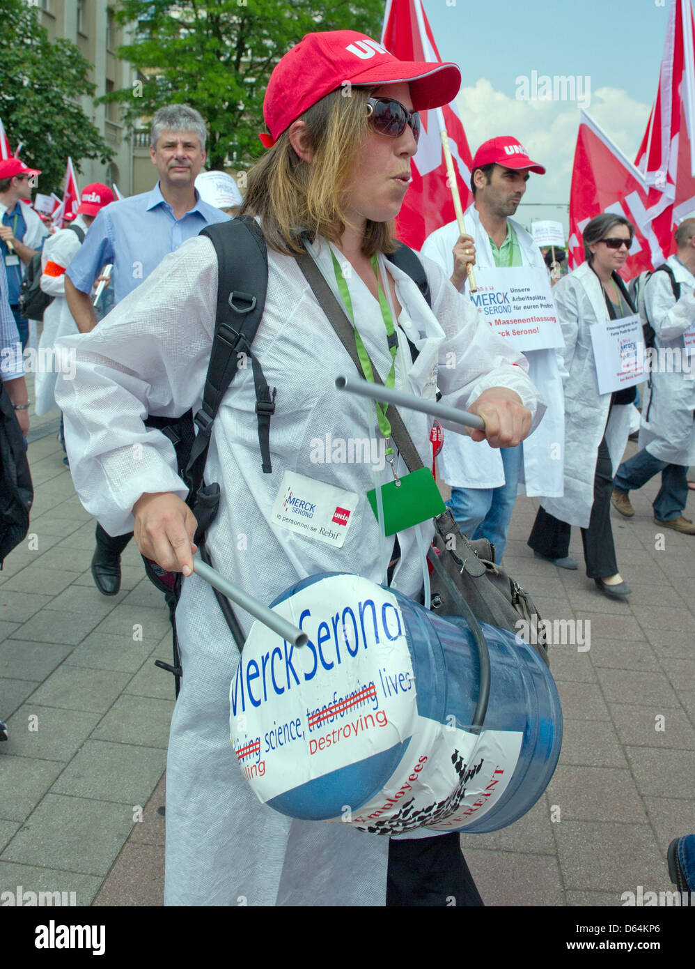 Employees of Merck demonstrate against planned redundancies in front of ...