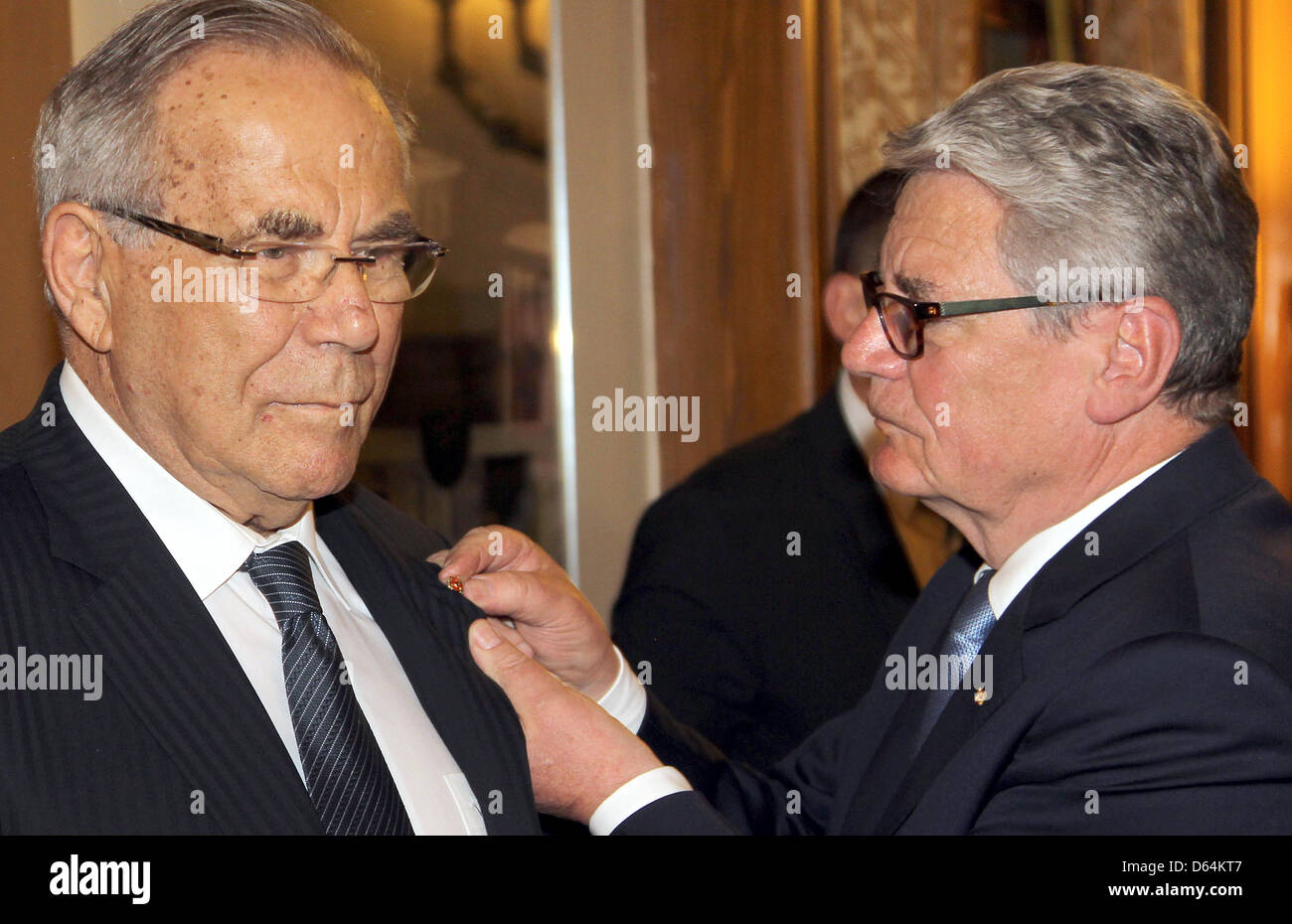 German President Joachim Gauck (R) awards the German Federal Cross of ...