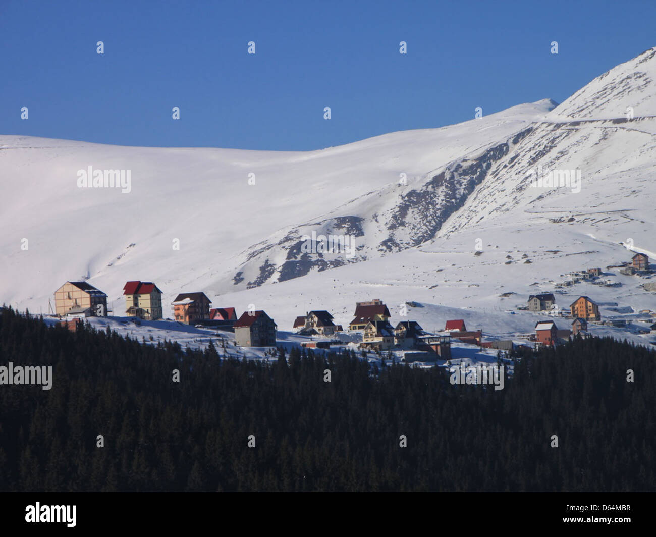 Winter homes and villages in the mountains, blanketed in snow ...