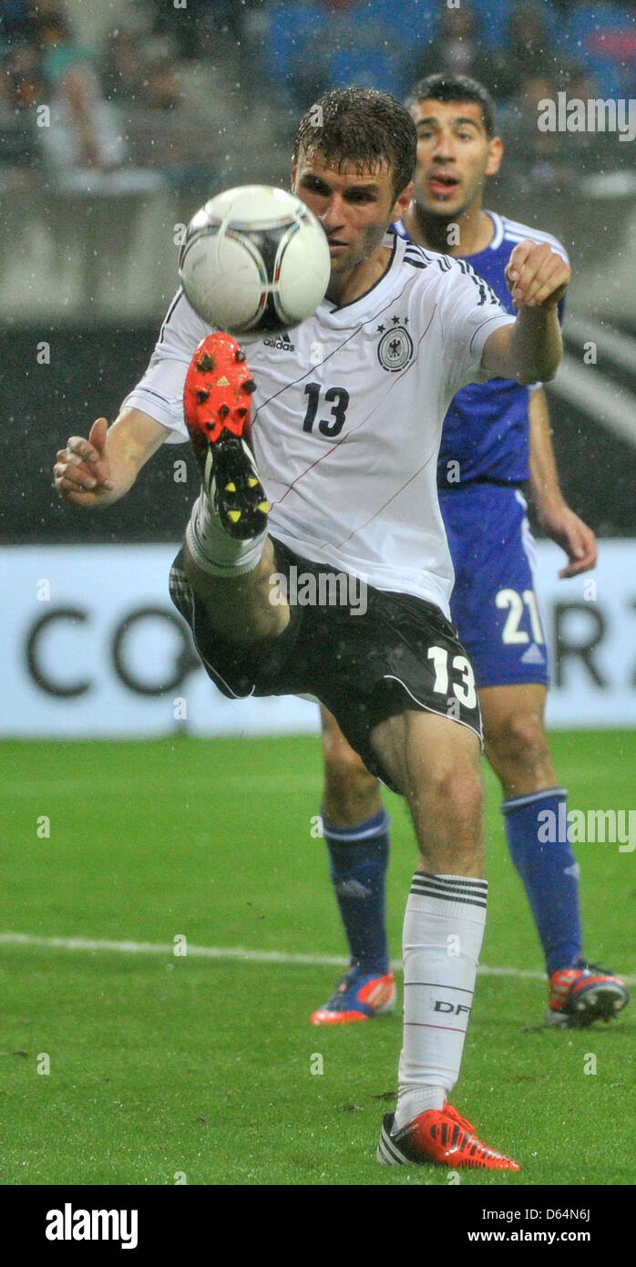 Germany's Thomas Mueller (L) and Israel's Eitan Tibi vie for the ball ...