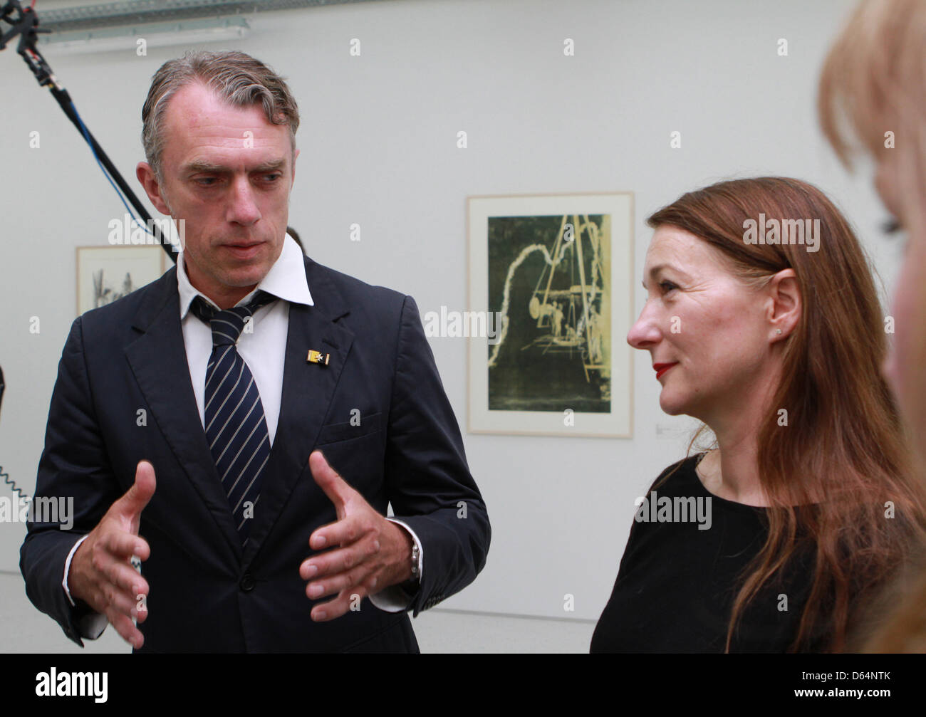 German artist Neo Rauch and his wife Rosa Loy (R) walk through the ...