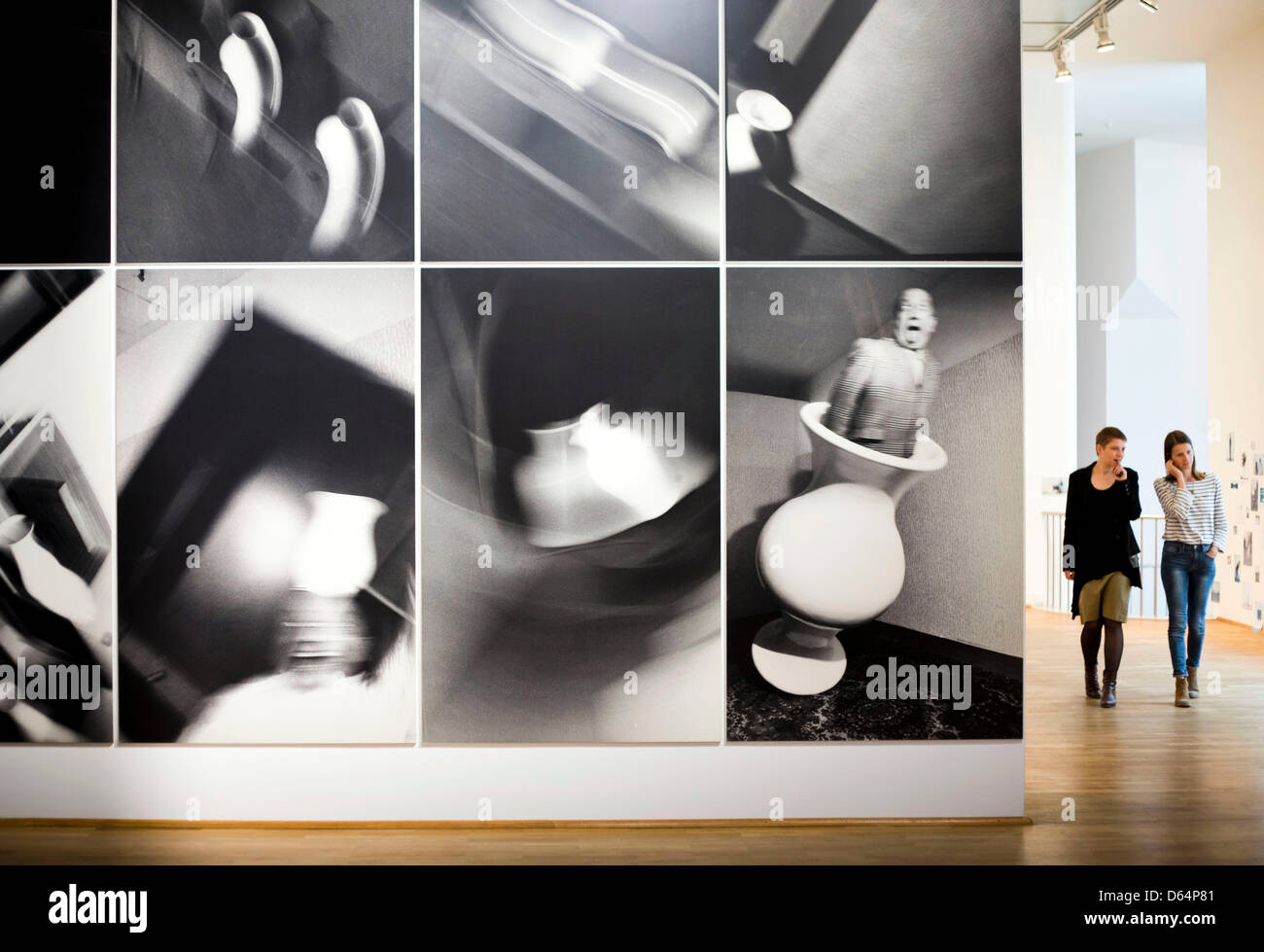 Visitors walk past photos of Anna and Bernhard Blume during the preview ...