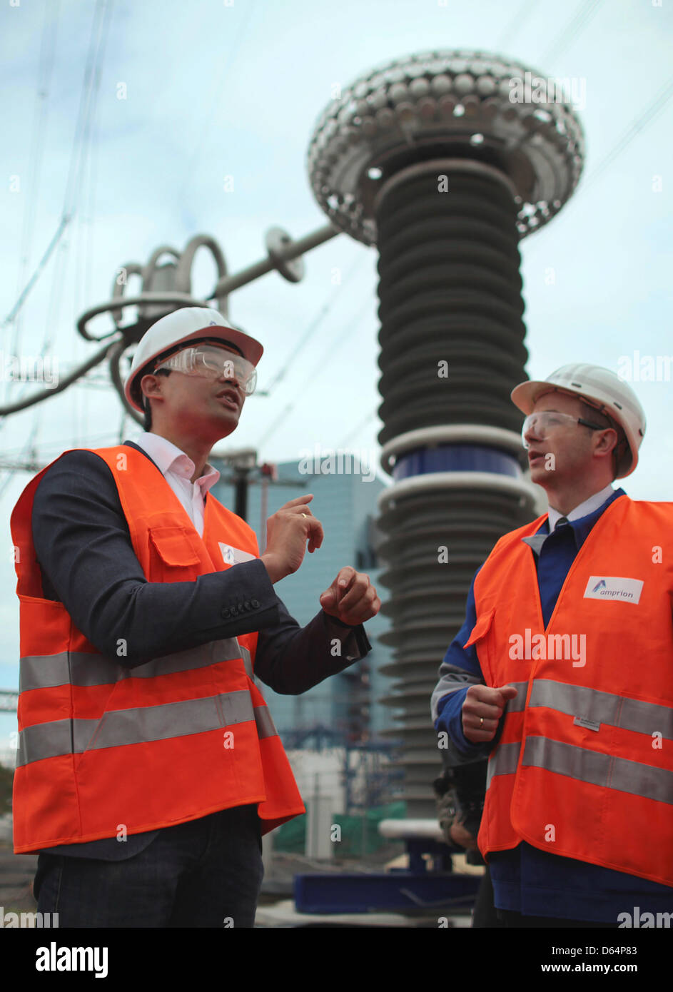 German Federal Minister of Economics Philipp Roesler (L) looks at the ...