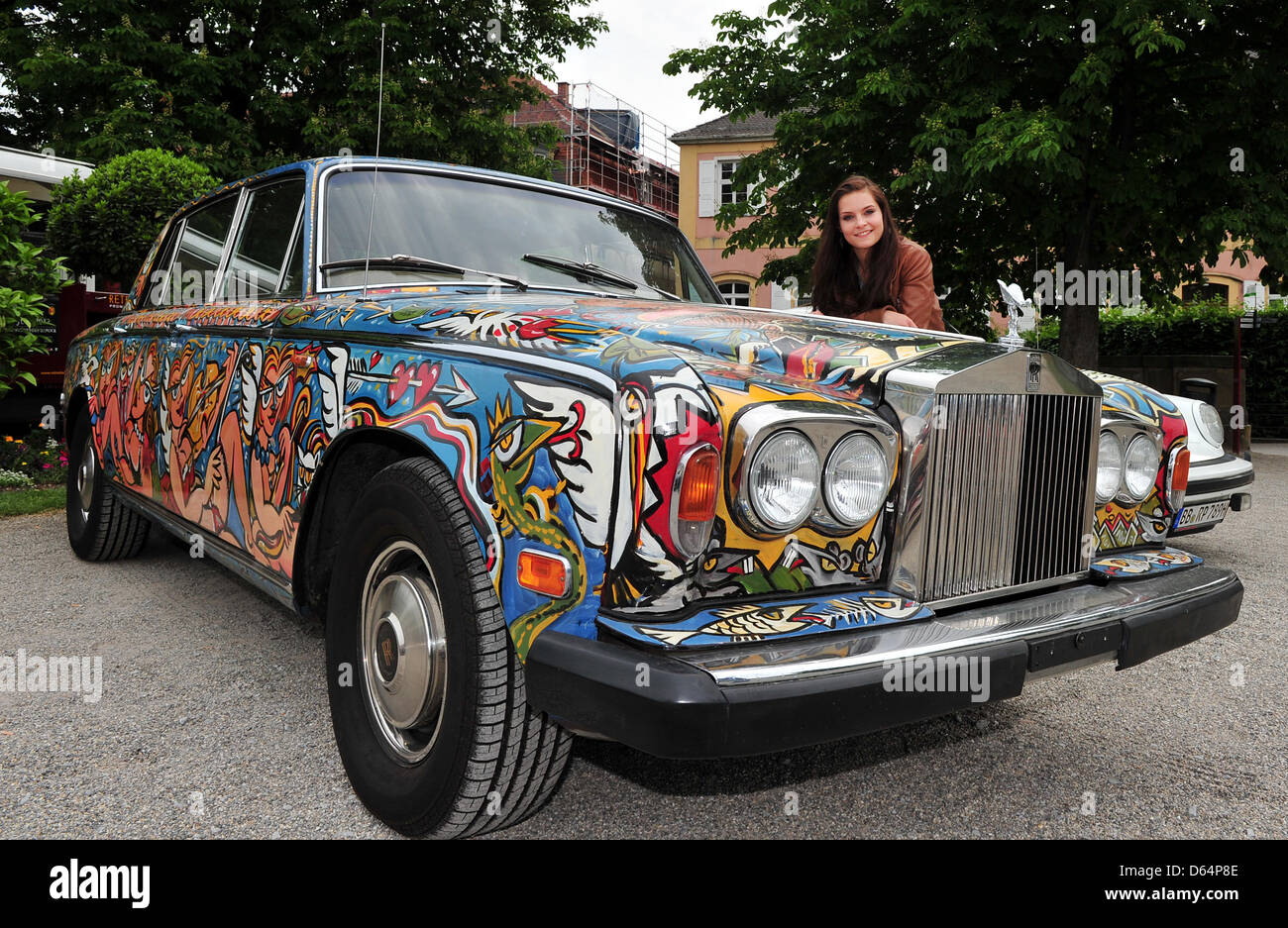 Model Anna-Lena poses with a colourfully painted Rolls Royce at the ...