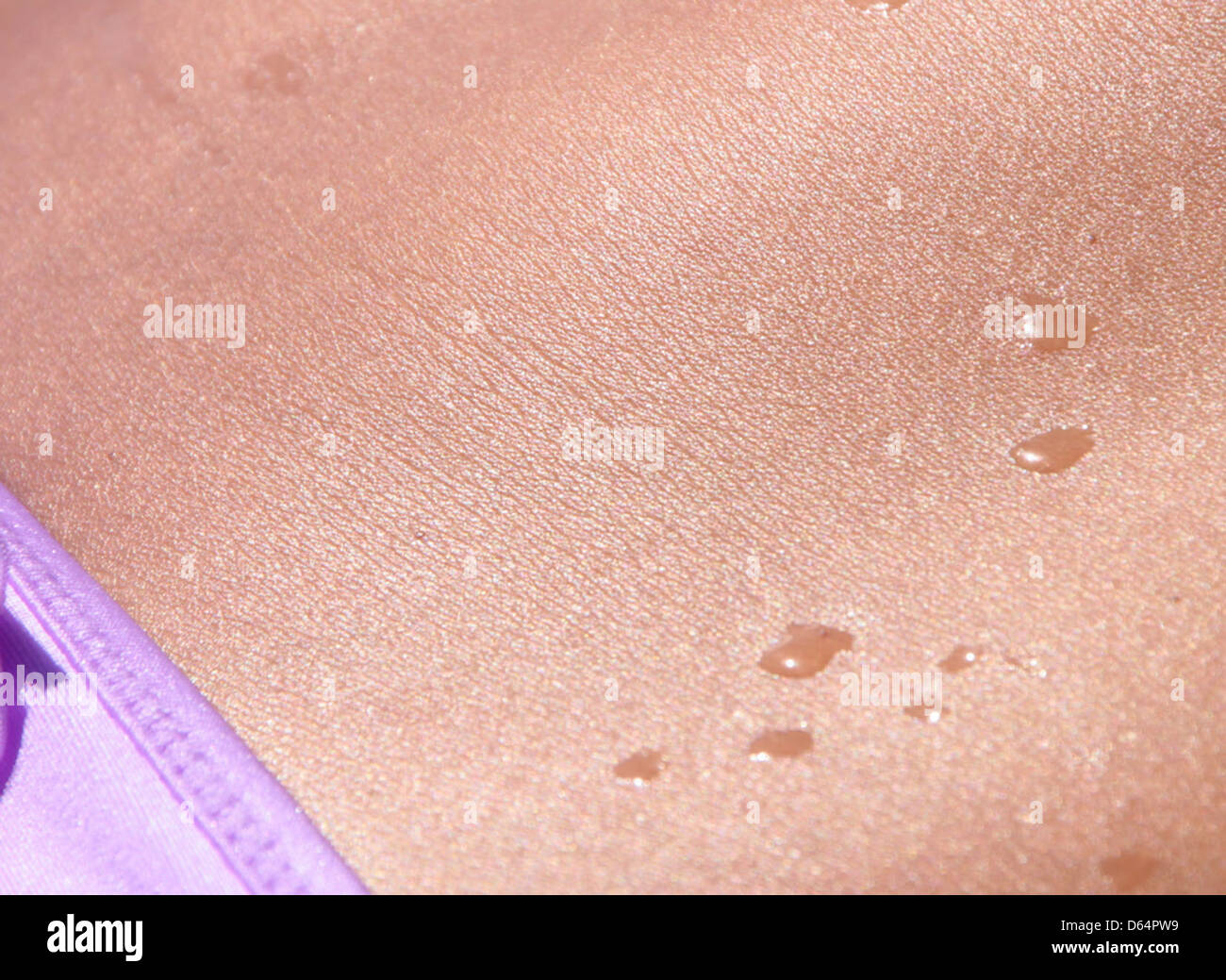 The image depicts a woman with her skin exposed to sunlight. The ...