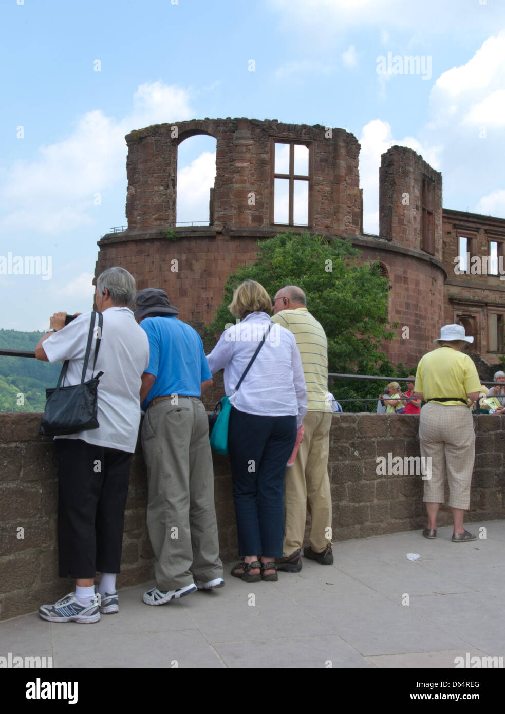 Tourists observe parts of the castle ruins in Heidelberg, Germany, 30 ...