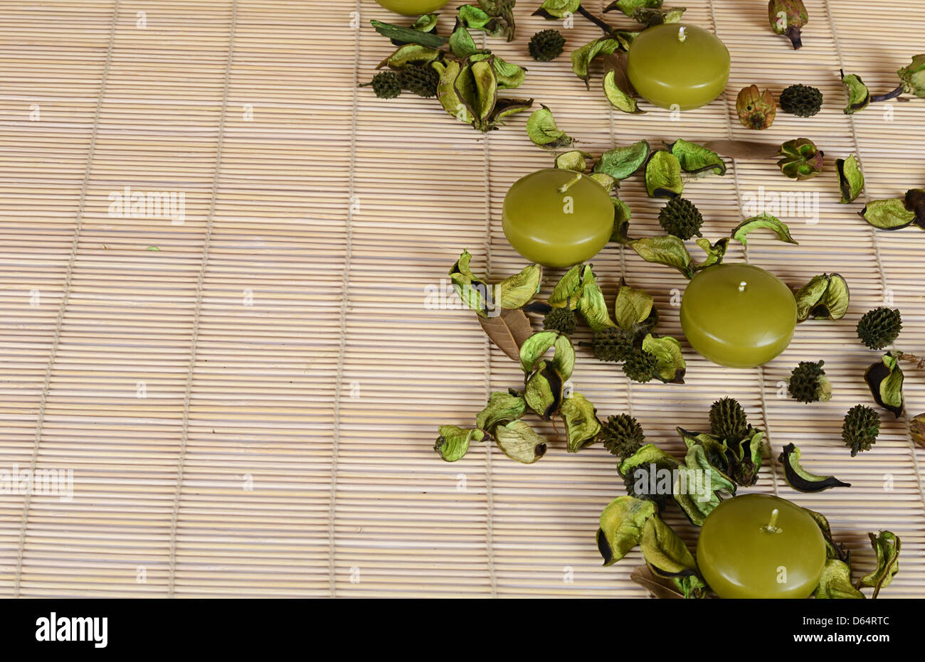 Aromatic candles on a bamboo rug Stock Photo - Alamy