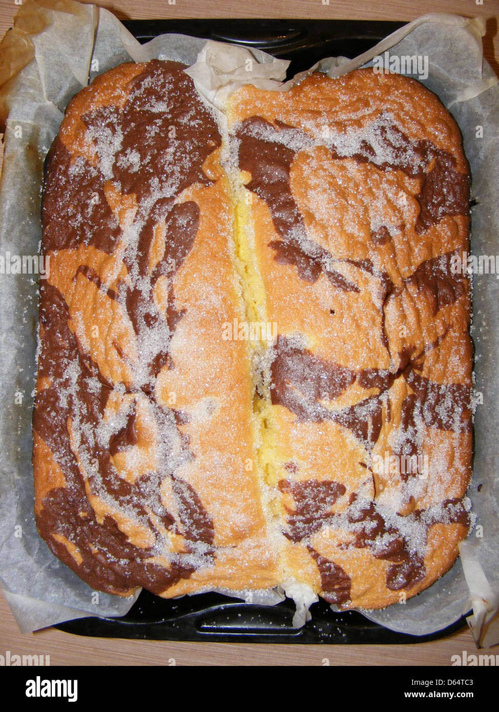 A freshly made homemade cake, topped with sugar. The image highlights ...