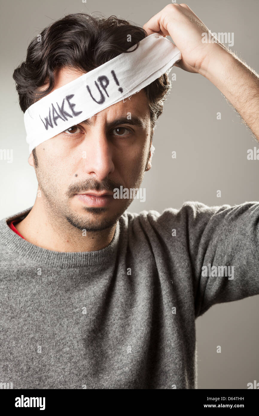 Man Taking Off a Bandage from His Eyes with "Wake Up!" Written On It ...