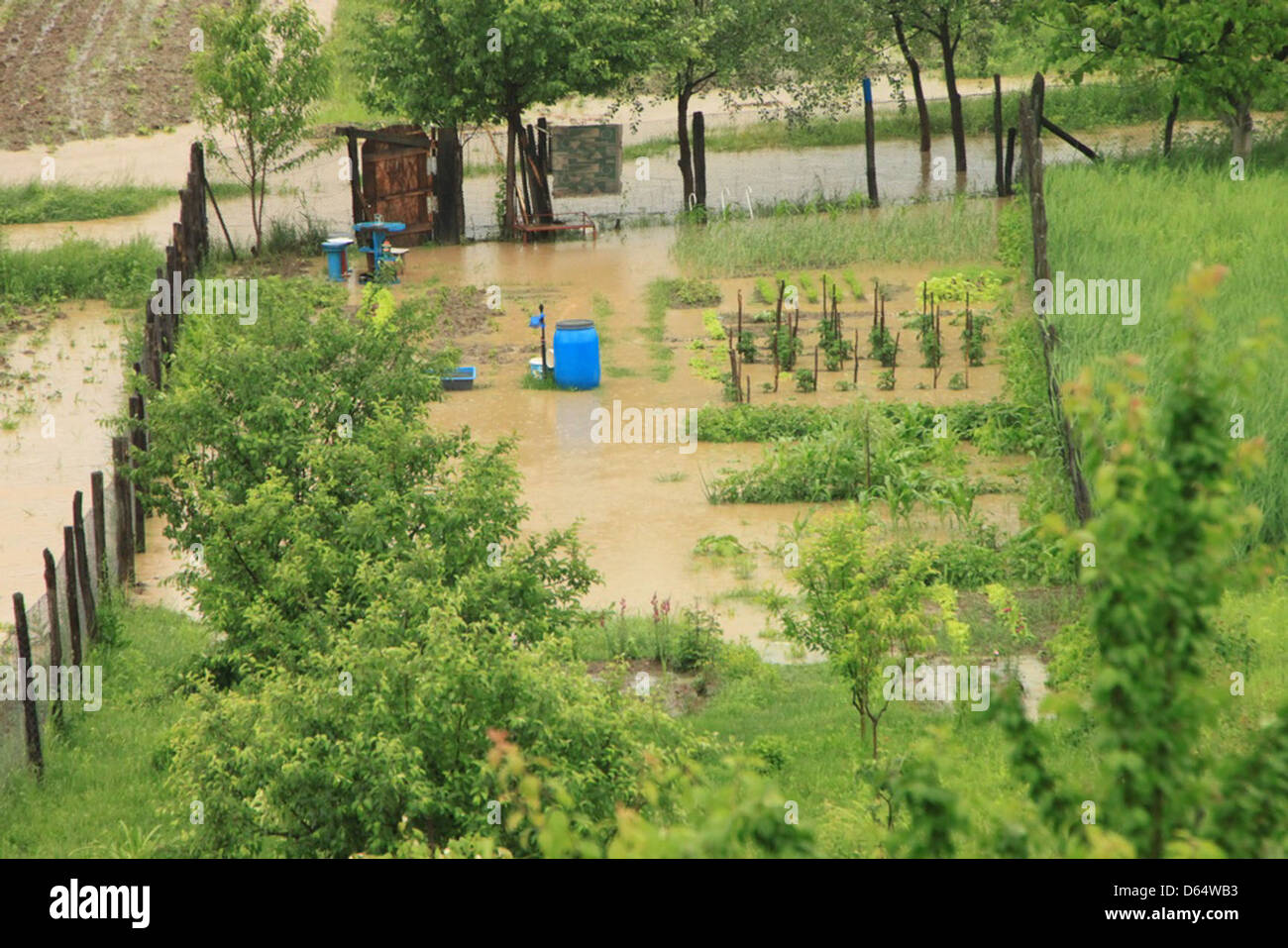 Agricultural land flooded by floodwaters, showing the impact of a ...