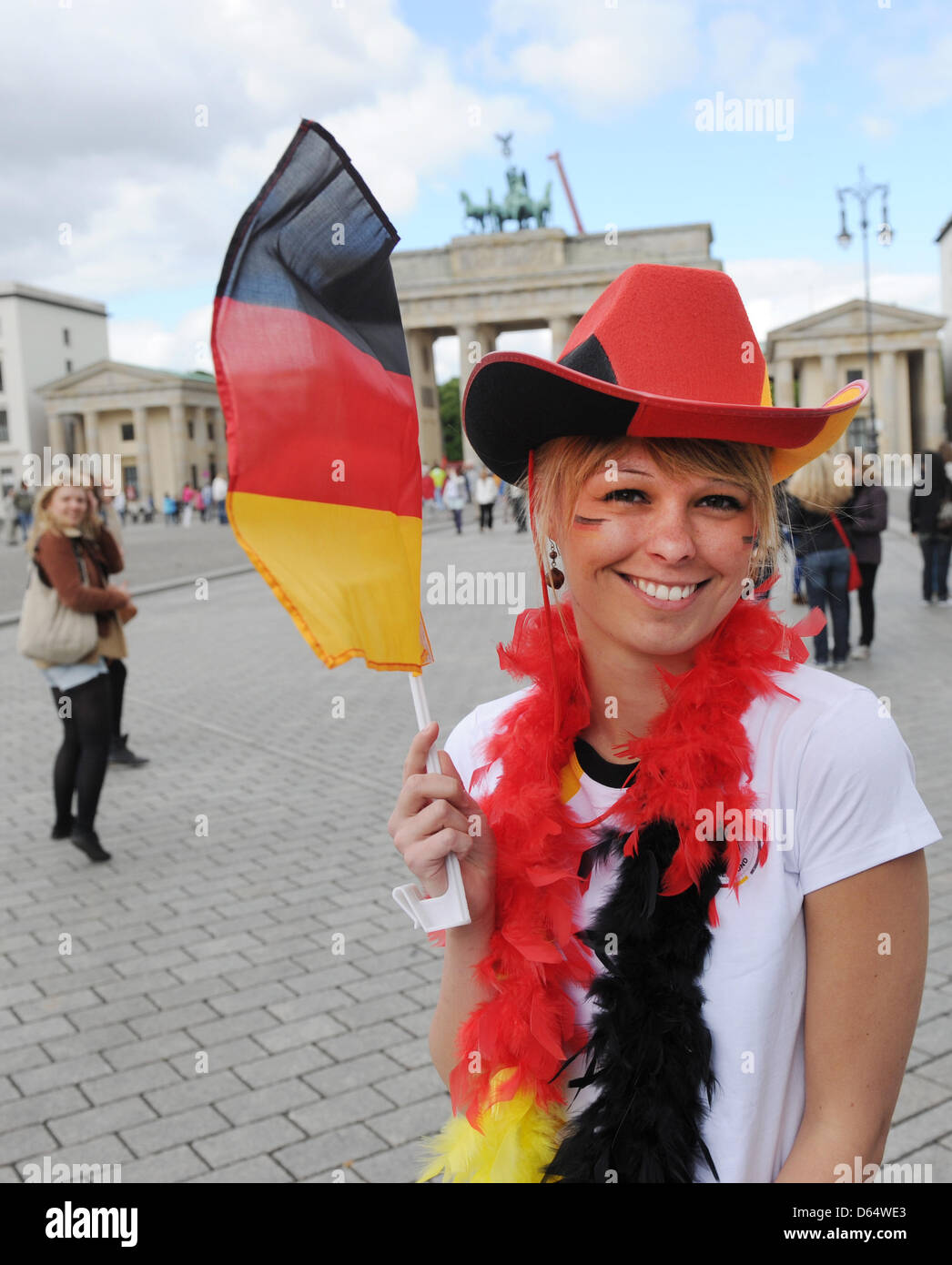 A female German fan is pictured in front of Brandenburg Gate close to ...