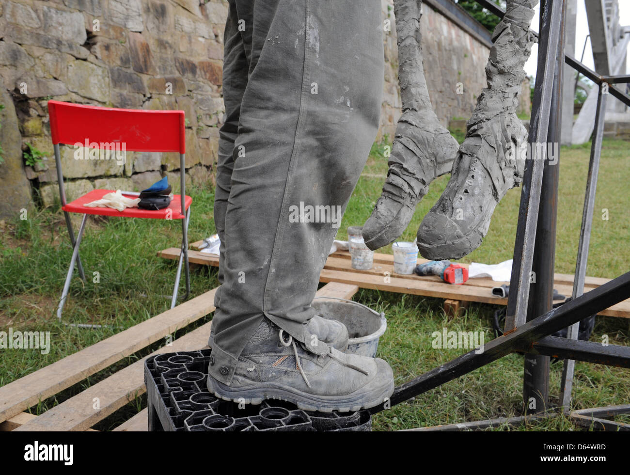A clay sculpture of Argentinian artist Adrian Villar Rojas is worked on ...