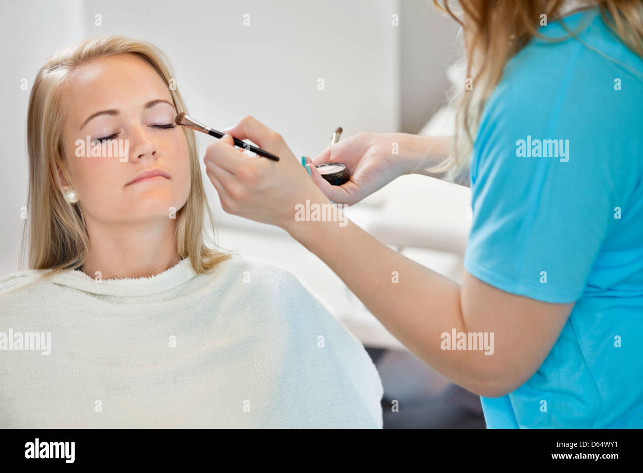 Beautician Applying Make Up To Woman Stock Photo - Alamy