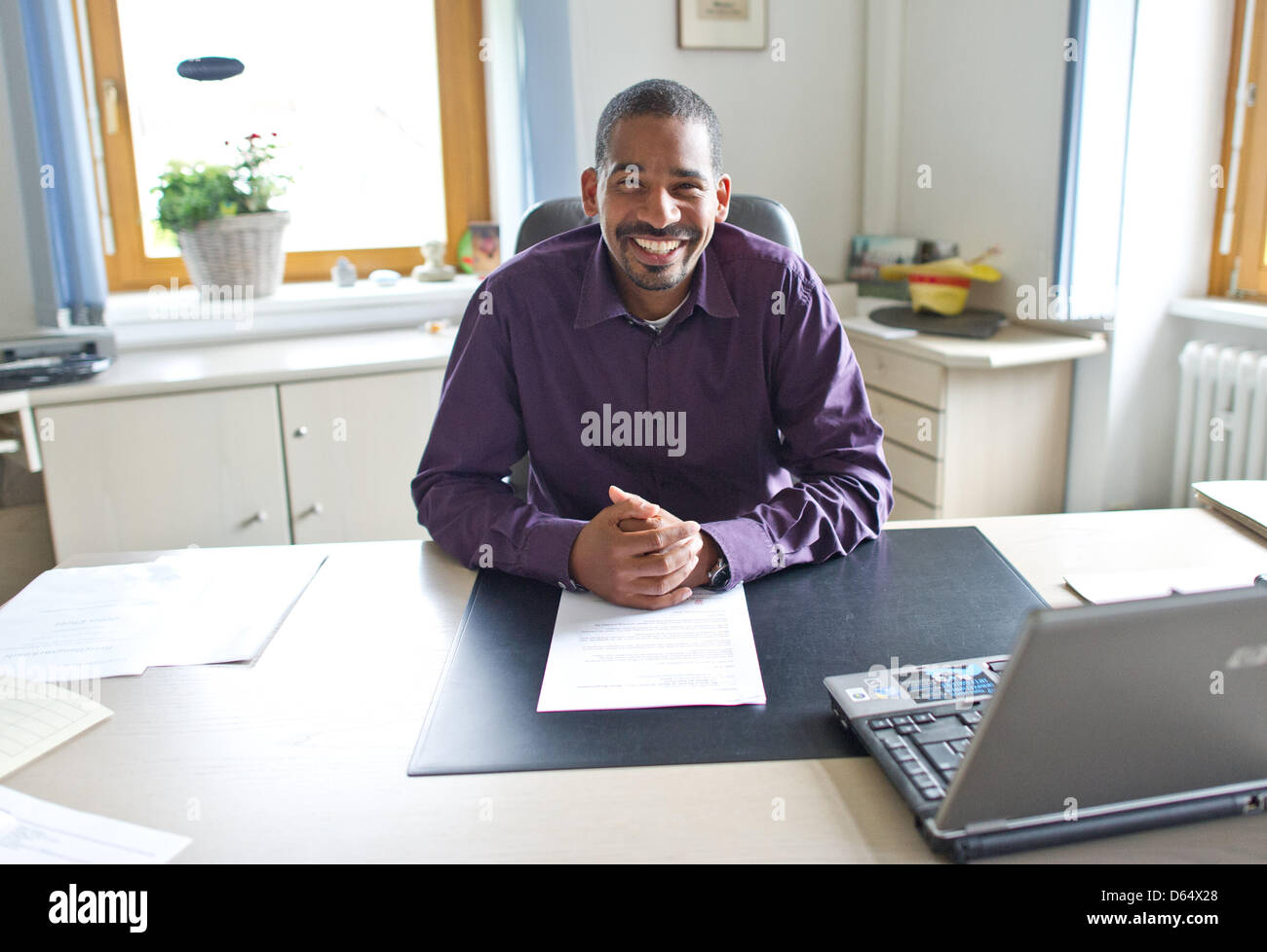 Mayor of Mauer John Ehret sits at his desk in Mauer, Germany, 04 June ...