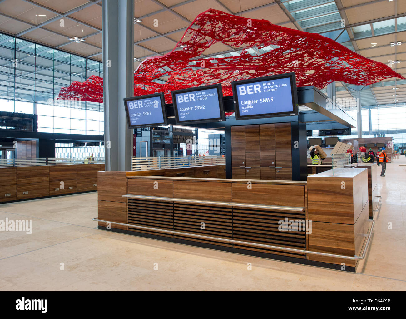 Check-in counters are pictured at the terminal of the new Berlin ...
