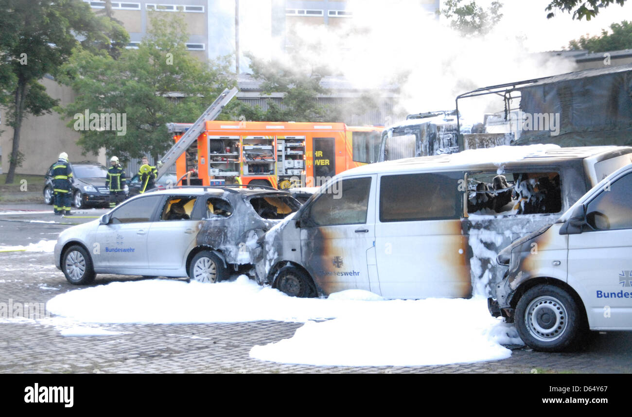 Partially burned out German Armed Forces (Bundeswehr) vehichles sit on ...