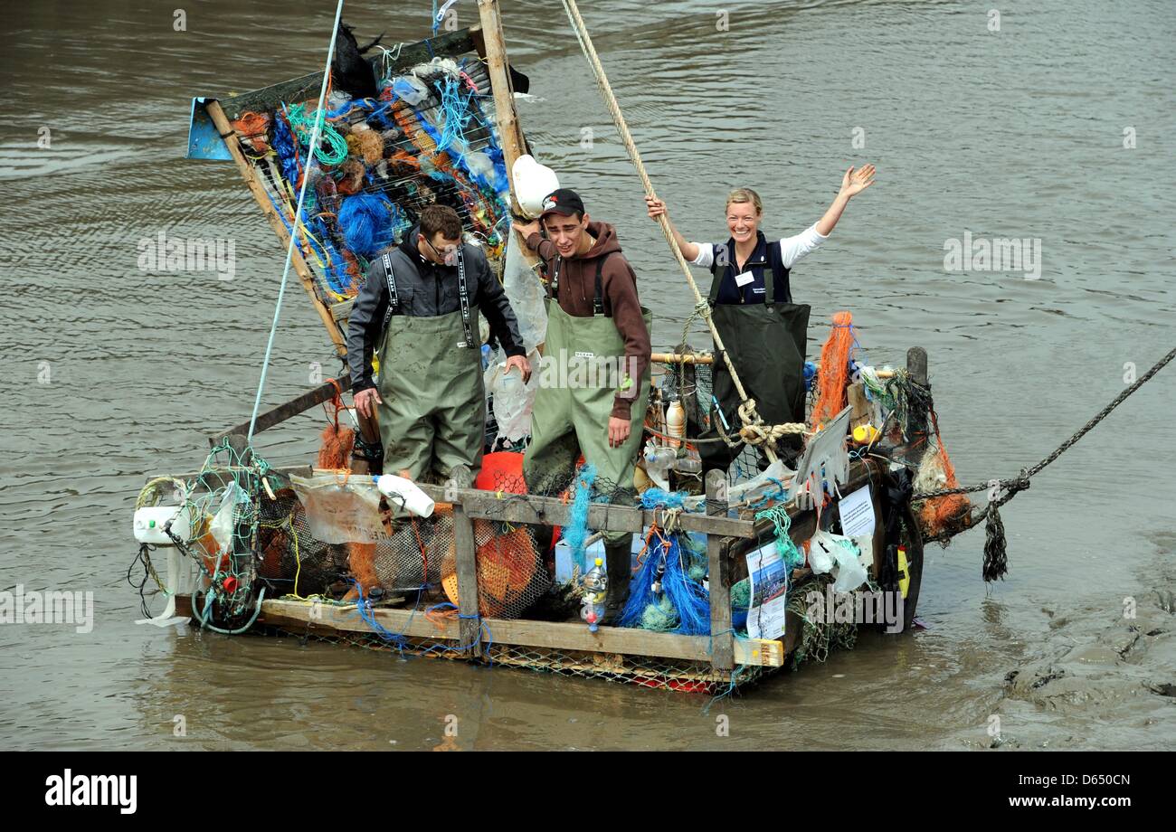 A raft made of marine garbage weighing around 300 kg is set afloat in ...