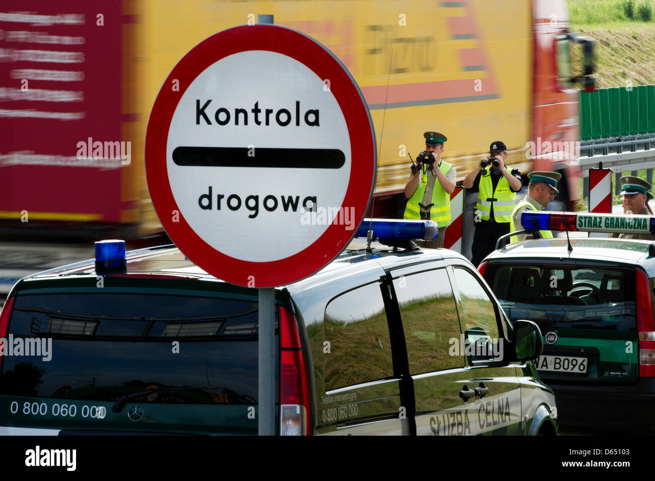 Polish policemen and customs officials staff a border checkpoint at the ...