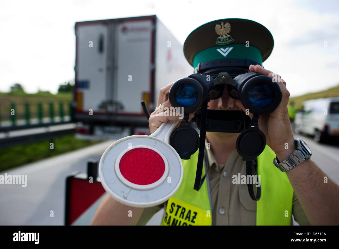 Polish policemen and customs officials staff a border checkpoint at the ...