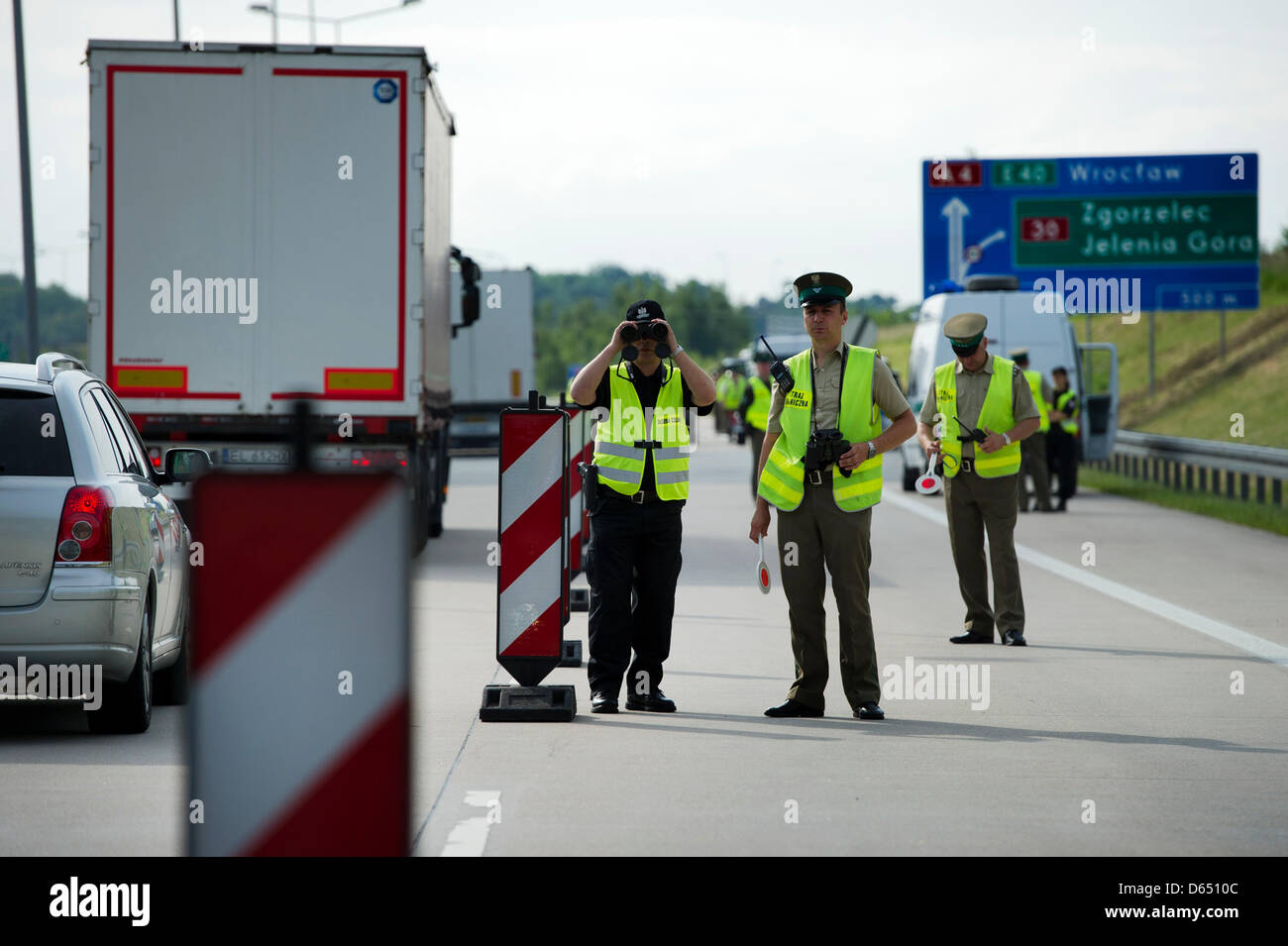 Polish policemen and customs officials staff a border checkpoint at the ...