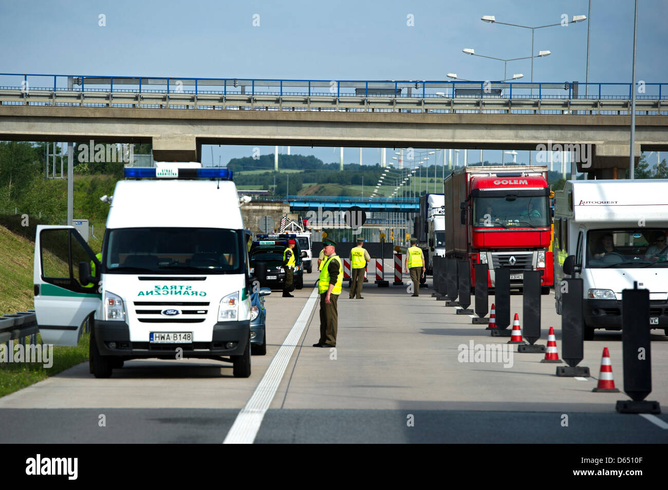 Polish policemen and customs officials staff a border checkpoint at the ...