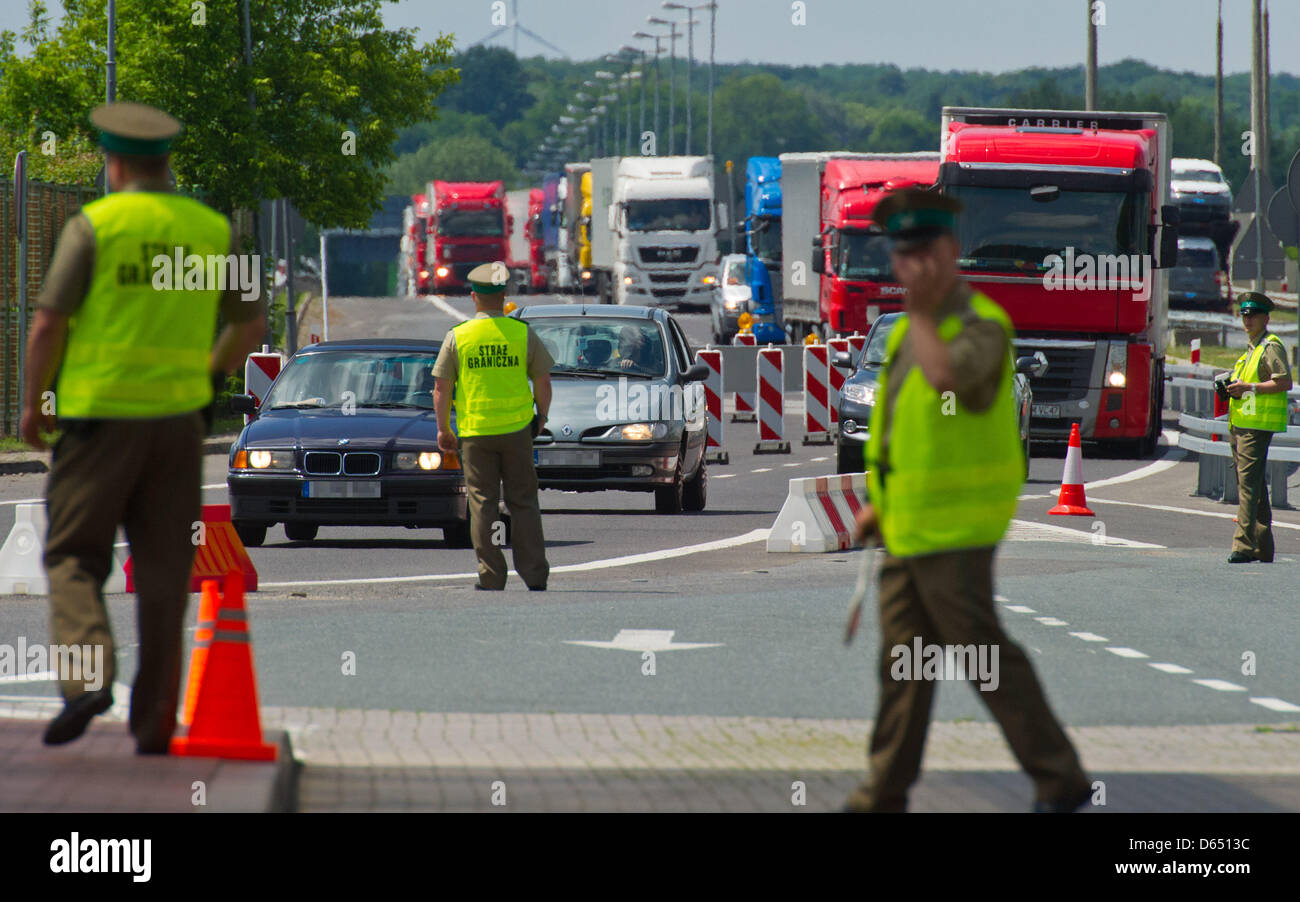 Polish policemen and customs officials staff a border checkpoint at the ...