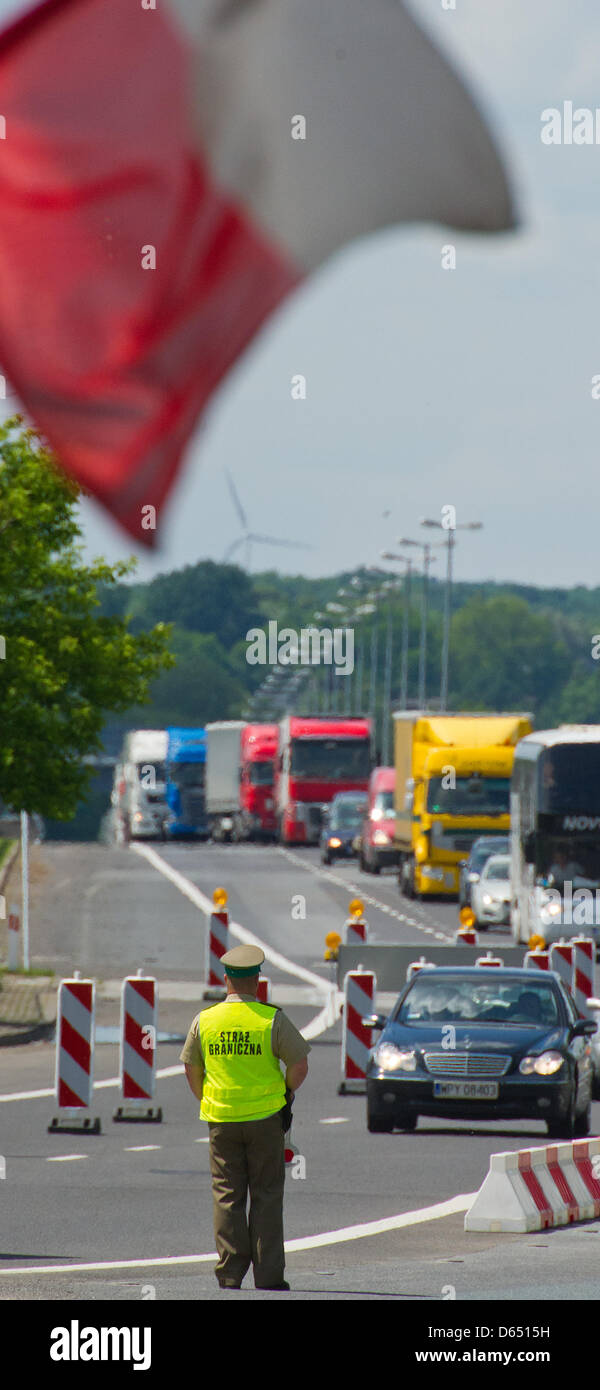 Polish policemen and customs officials staff a border checkpoint at the ...