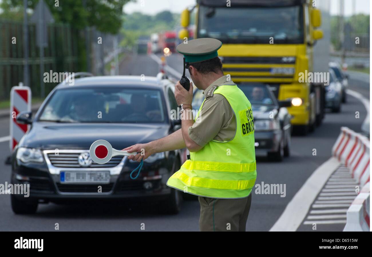 Polish policemen and customs officials staff a border checkpoint at the ...