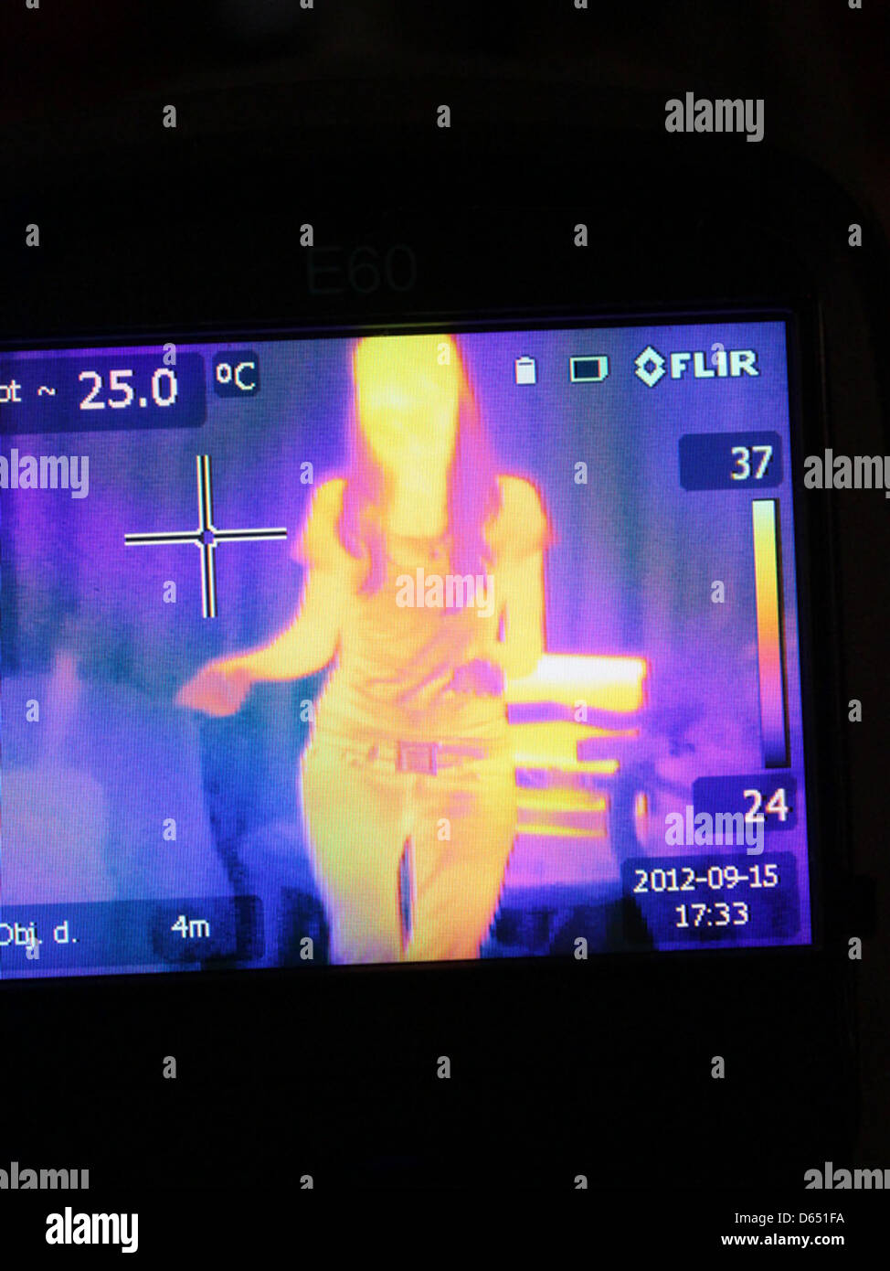 An infrared thermography image showing individuals with varying ...