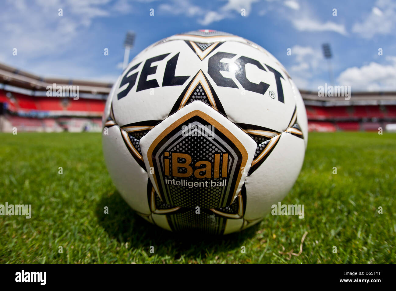 A test ball equipped with a chip lies on the pitch of Frankenstadion in ...