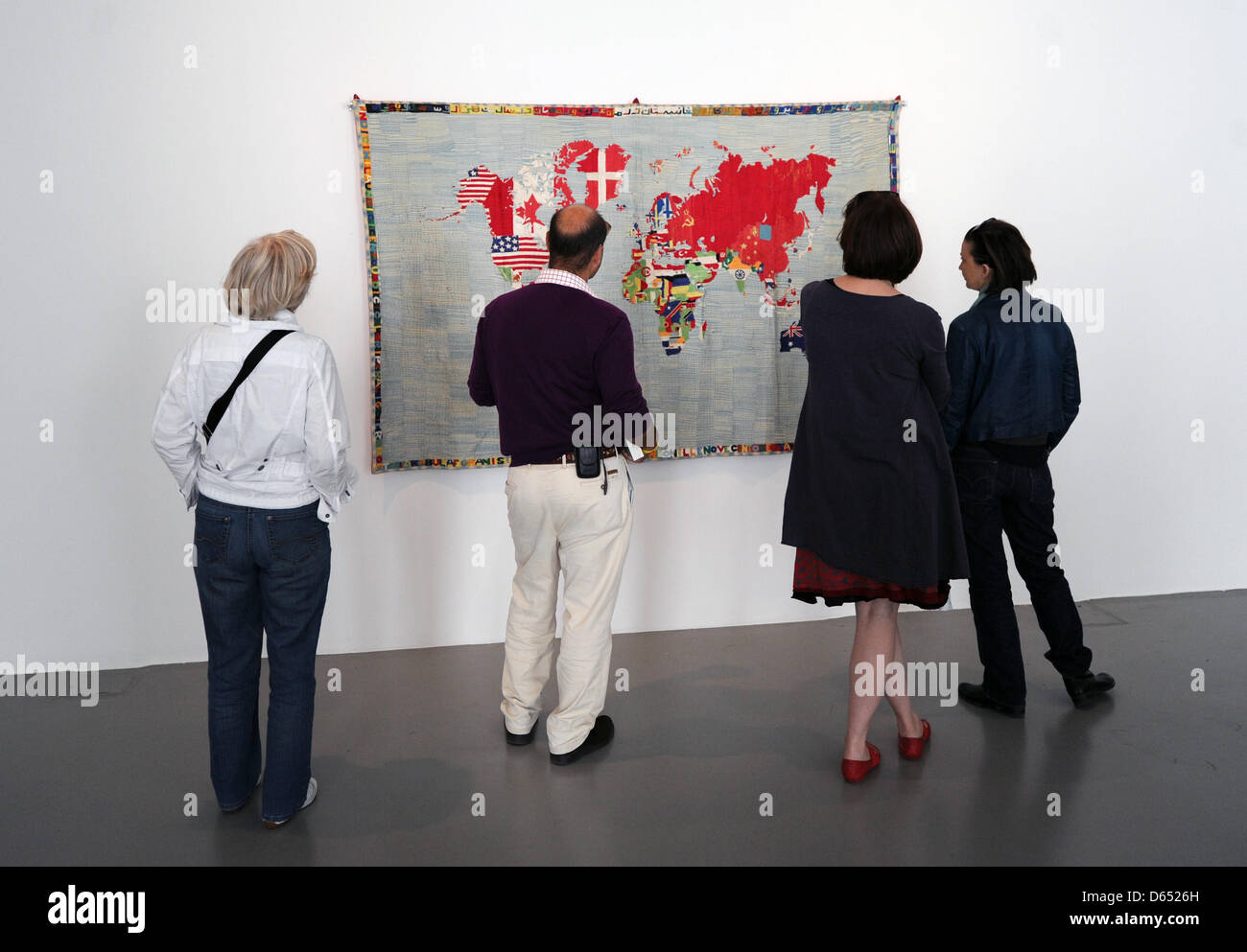Visitors view the tapestry 'Mappa' by Italian artist Alighiero Boetti ...