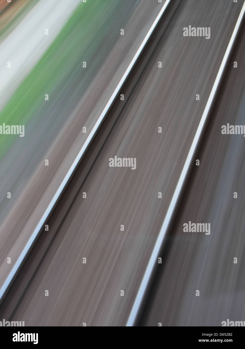 The image captures a railway track viewed at high speed, showcasing the ...