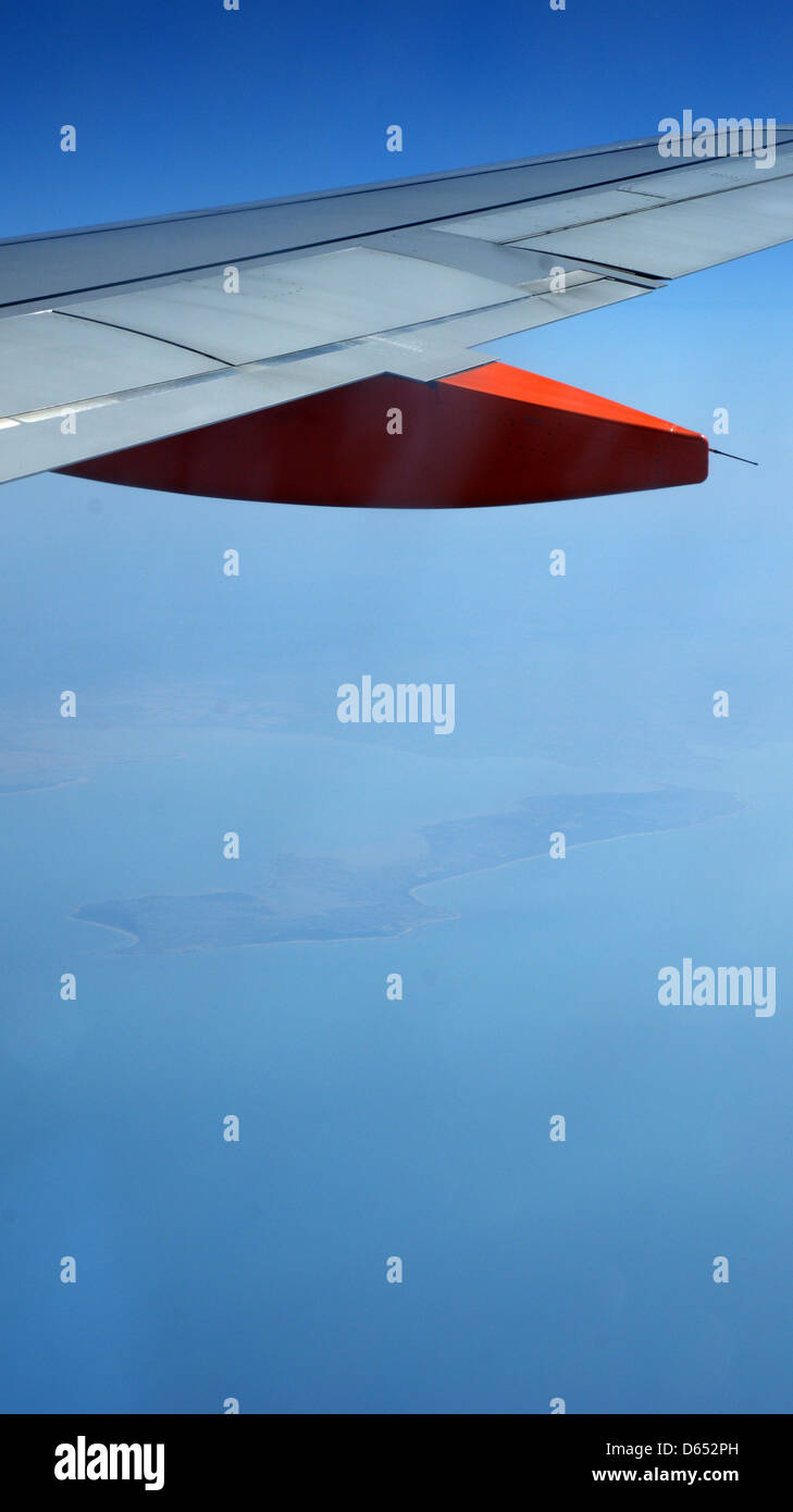 tropical island blue clear sky mist horizon plane flying over Stock ...