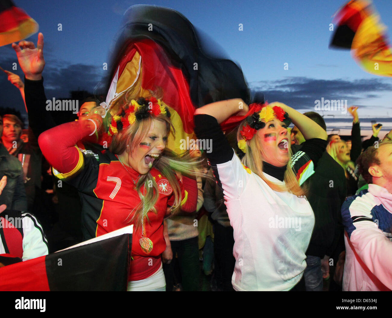 Soccer fans cheer during the UEFA EURO 2012 group B soccer match ...
