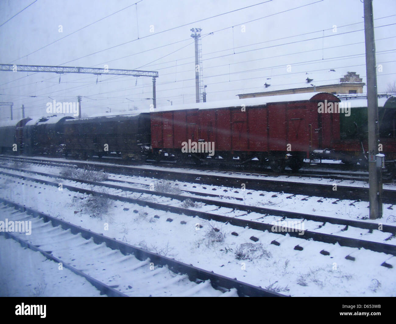 The train tracks in winter are covered with snow, highlighting the ...
