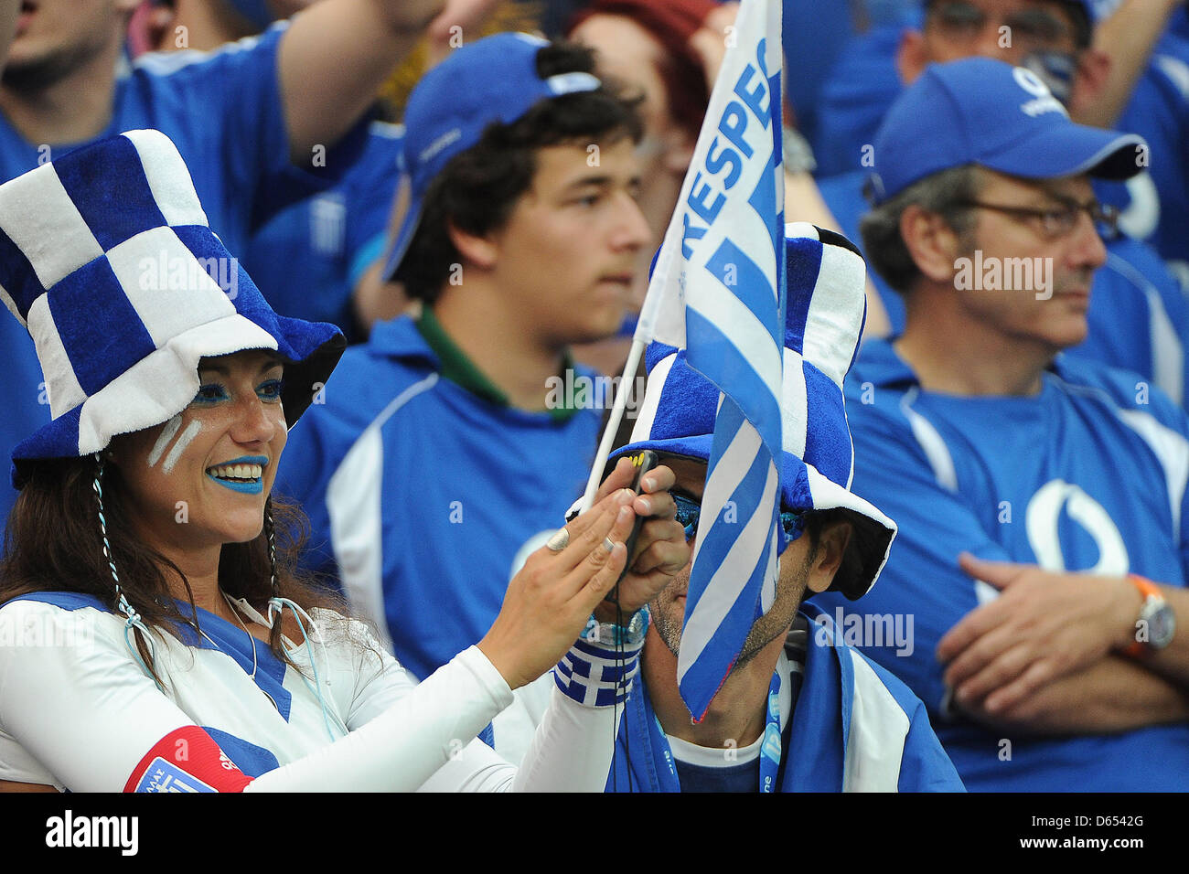 Fans of Greece cheer during the UEFA Euro 2012 match between Poland and ...