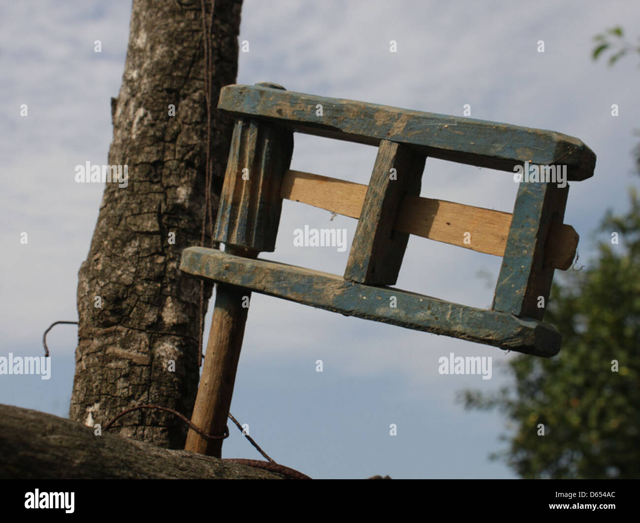 A scarecrow noise device is used in agricultural fields to deter birds ...