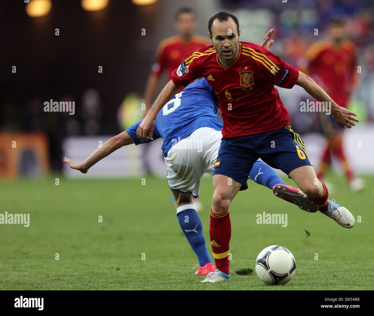 Spain's Andres Iniesta (R) and Italy's Claudio Marchisio vie for the ...