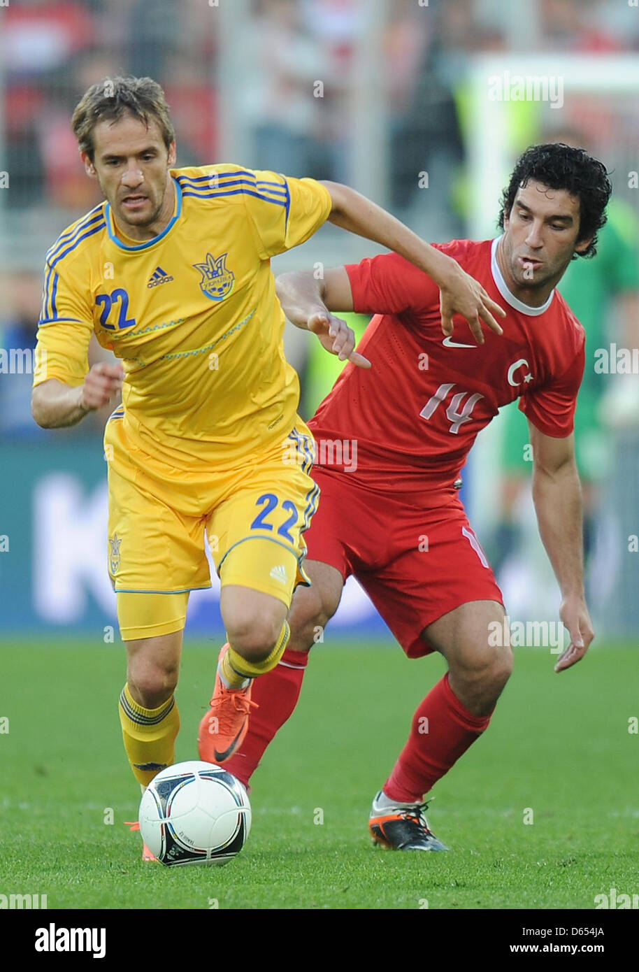 Marko Devic (L) of Ukraine and Tunay Torun of Turkey vie for the ball ...