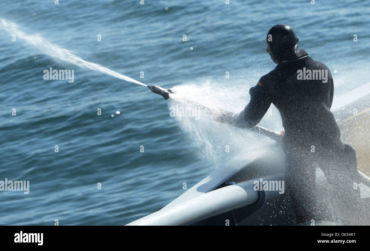 A diver of the German Armed Forces tests a jetting lance for the ...