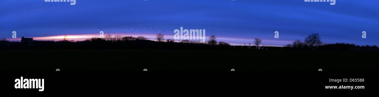 sunset tree field empty park land clouds clear Stock Photo - Alamy