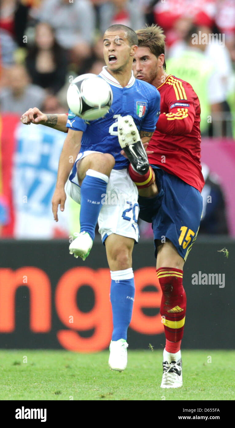 Spain's Sergio Ramos (back) and Italy's Sebastian Giovinco (front) vie ...
